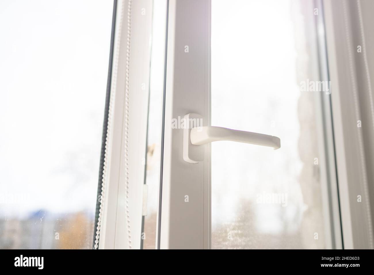 White plastic pvc window with forest background at home. Sunbeam ...