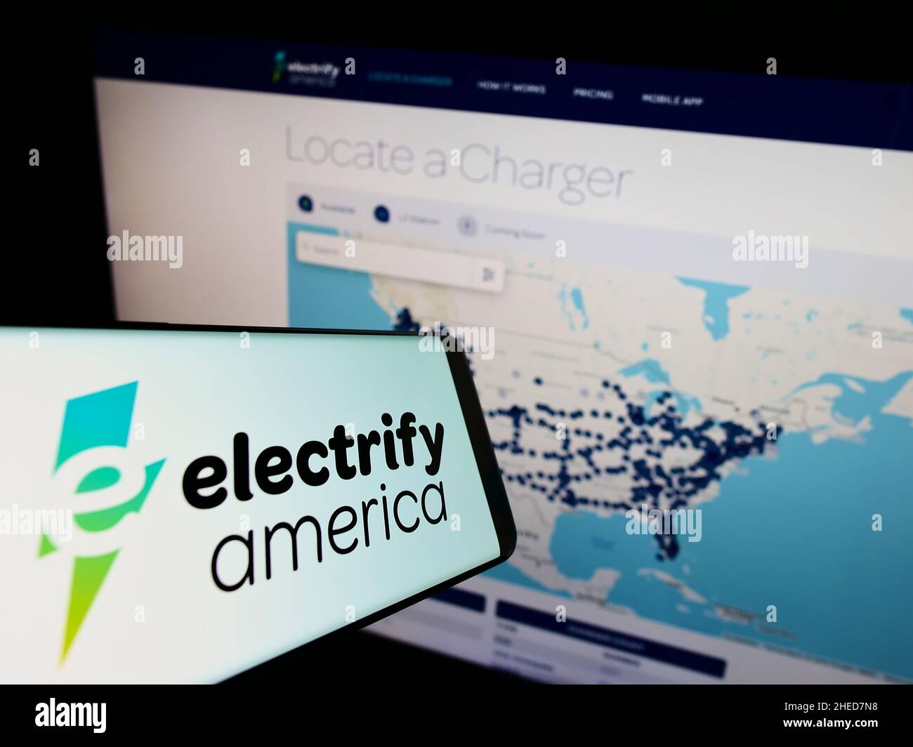 Smartphone with logo of US EV charging company Electrify America LLC on ...