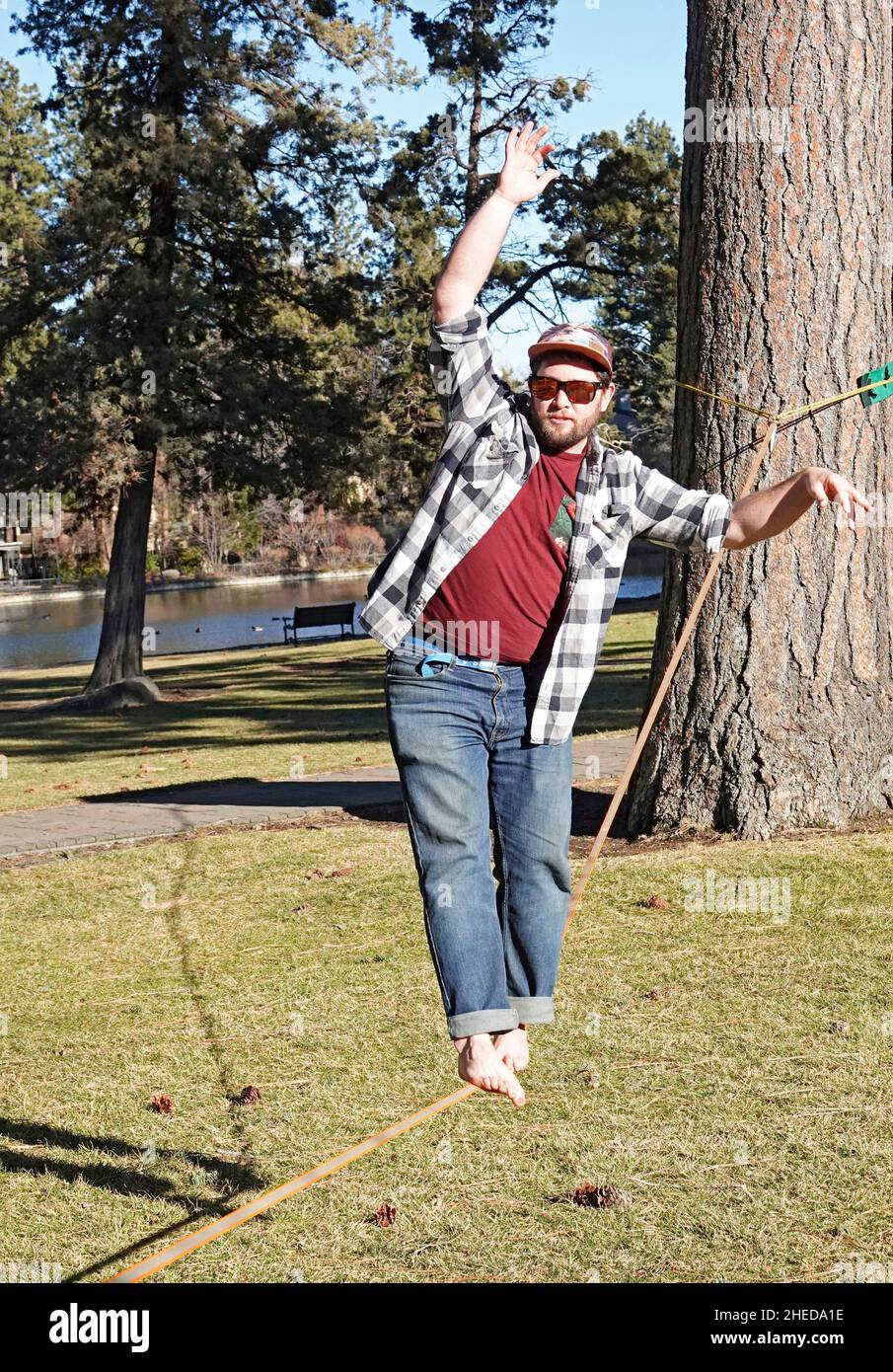 A college student practices an activity known as Slack Lining, walking ...