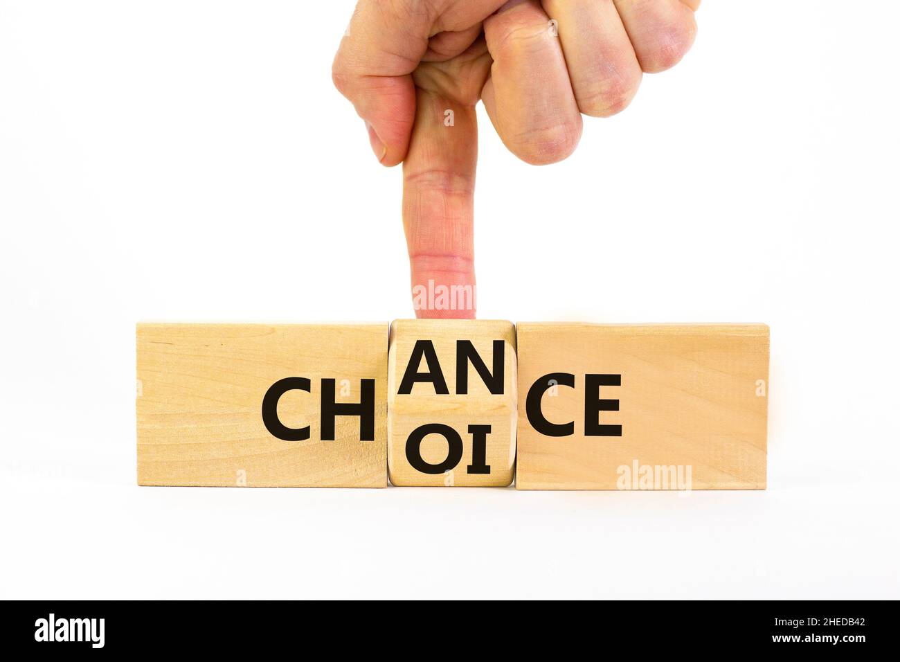 Choice and chance symbol. Businessman turns the wooden cube and changes ...