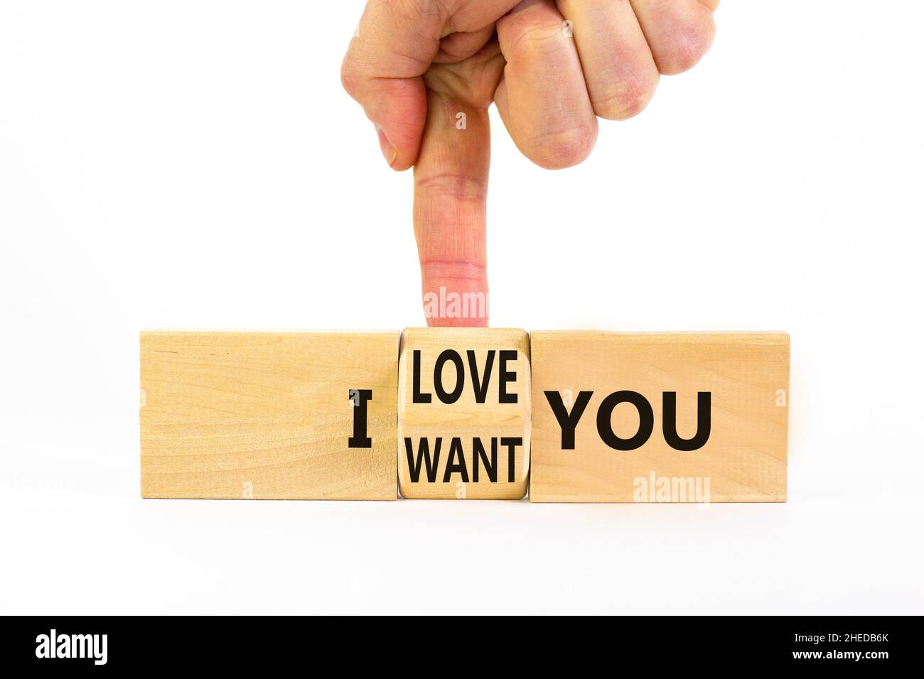 I love and want you symbol. Psychologist turns wooden cubes and changes ...