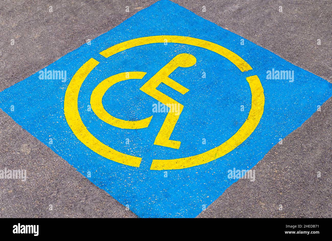 Empty wheel chair on disabled parking space hi-res stock photography ...