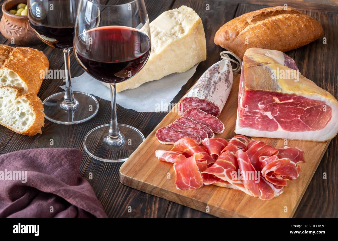 Prosciutto ham with parmesan, ciabatta and red wine Stock Photo - Alamy