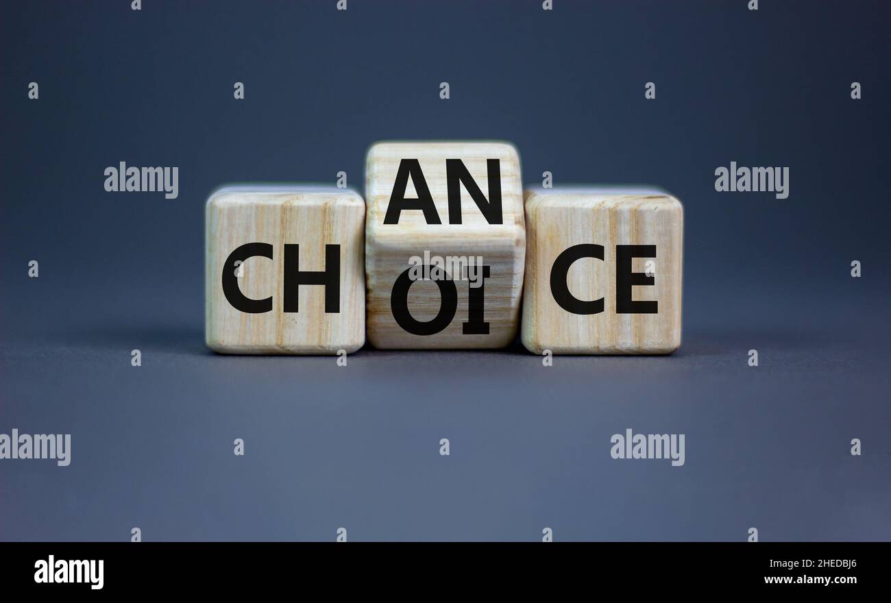 Choice and chance symbol. Businessman turns the wooden cube and changes ...