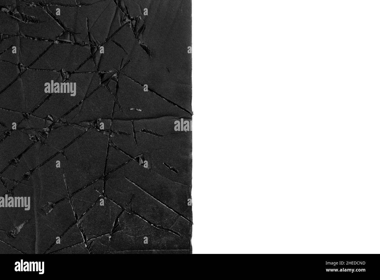 Scratched torn black paper isolated on white. Damaged half background ...