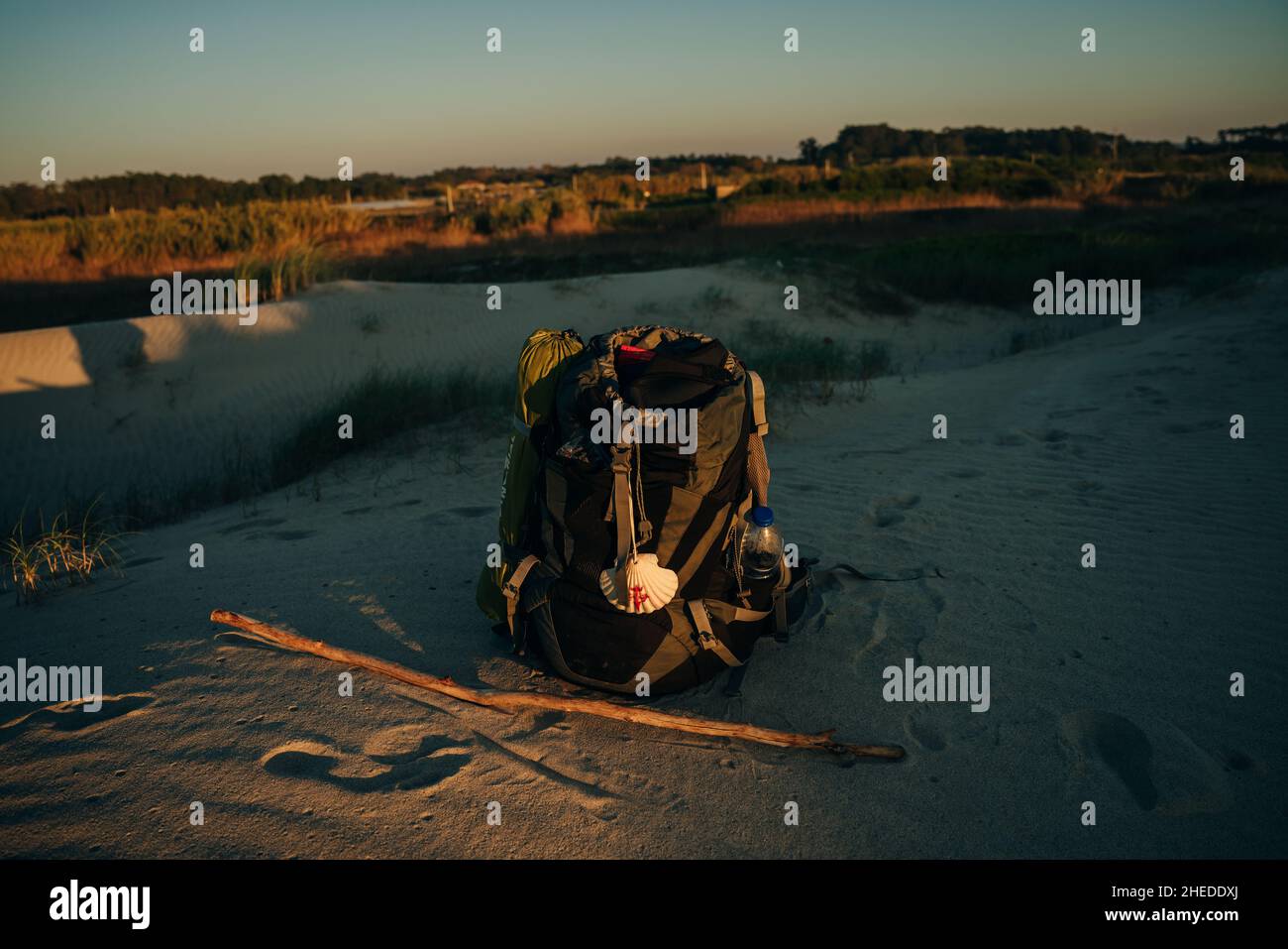 pilgrim's backpack with seashell on the beach Stock Photo - Alamy