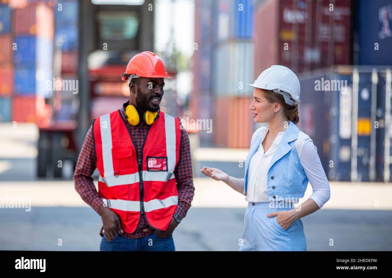 Foreman control loading Containers box from Cargo freight ship for ...