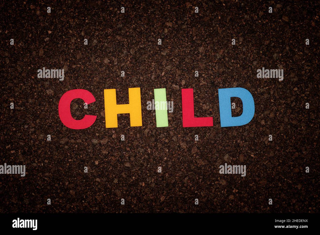 The word Child on a cork board. Close up Stock Photo - Alamy