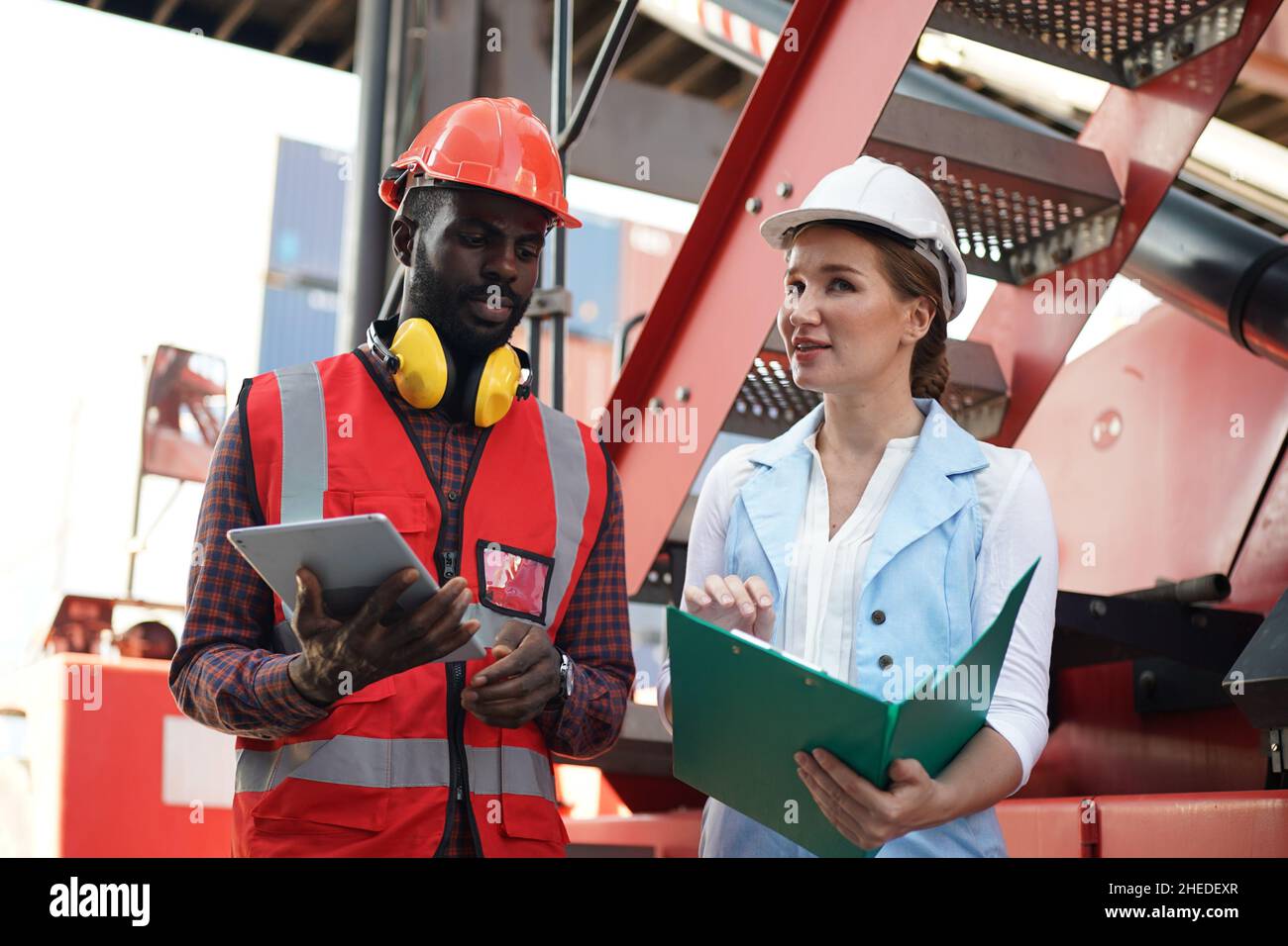 Foreman control loading Containers box from Cargo freight ship for ...