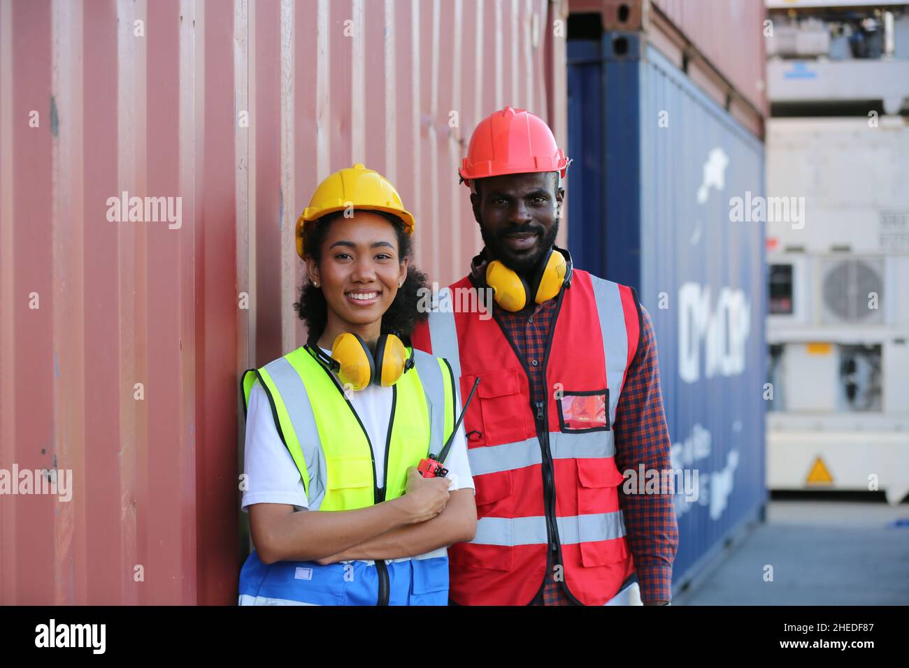 Foreman control loading Containers box from Cargo freight ship for ...