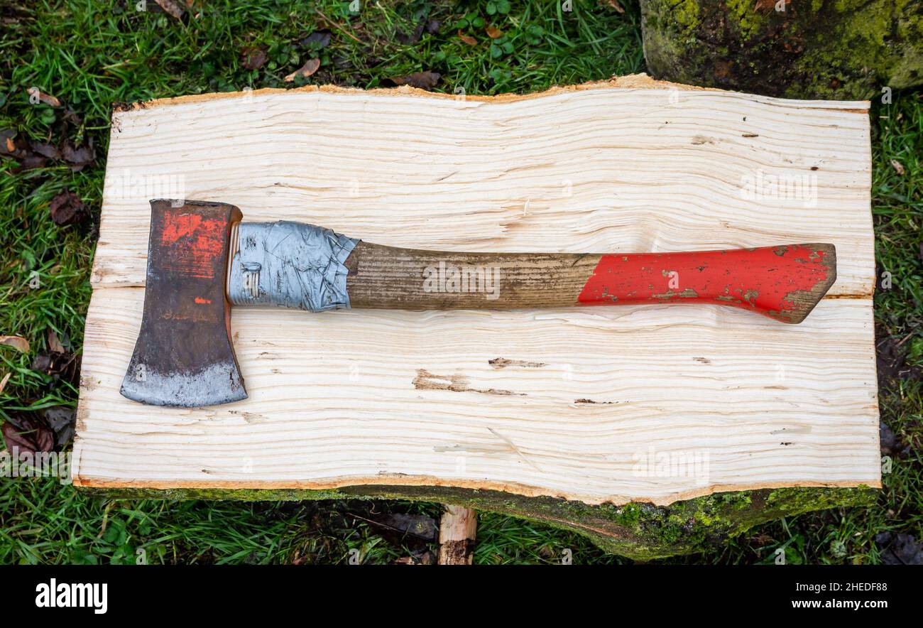 An old axe displayed on the freshly split log Stock Photo - Alamy