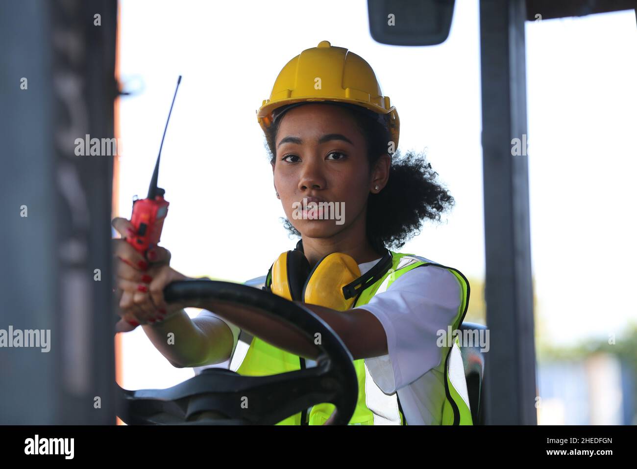 Foreman control loading Containers box from Cargo freight ship for ...