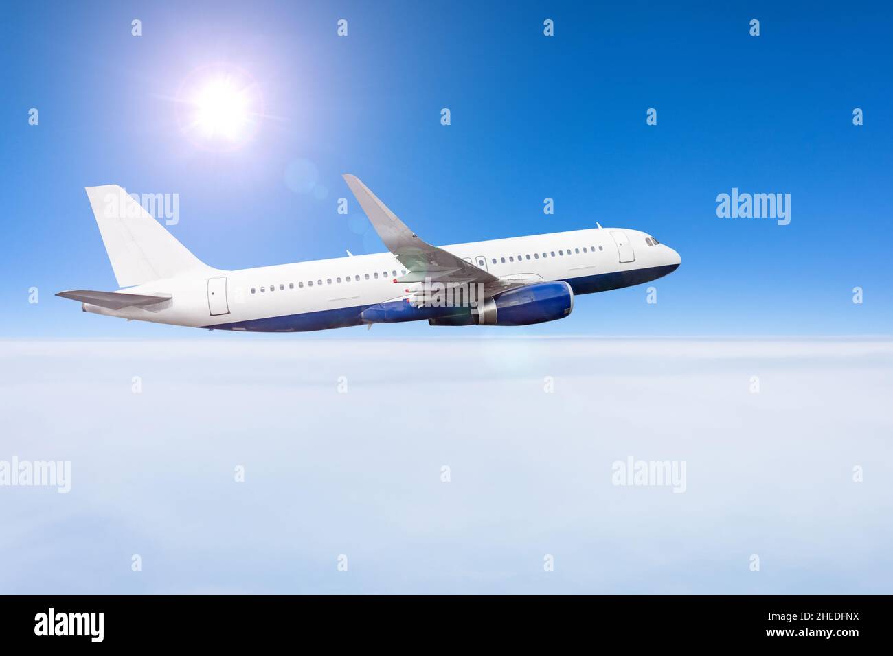 Passenger airplane flying in the daytime sky cloudscape overcast Stock ...