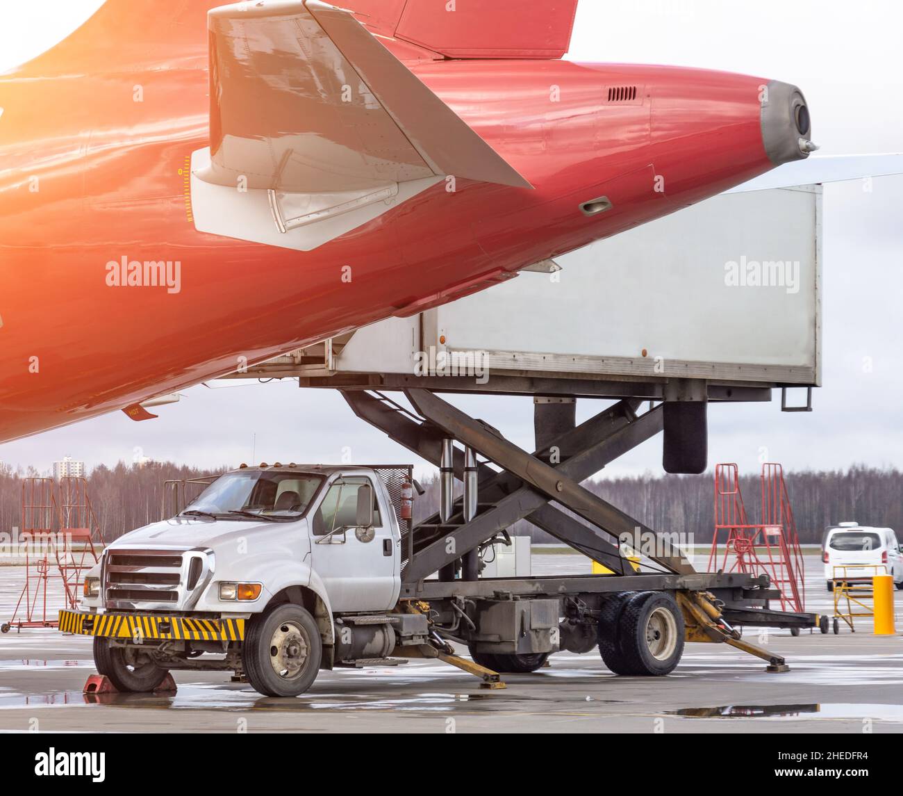 Loading platform truck of air freight to the tail aircraft. Food for ...