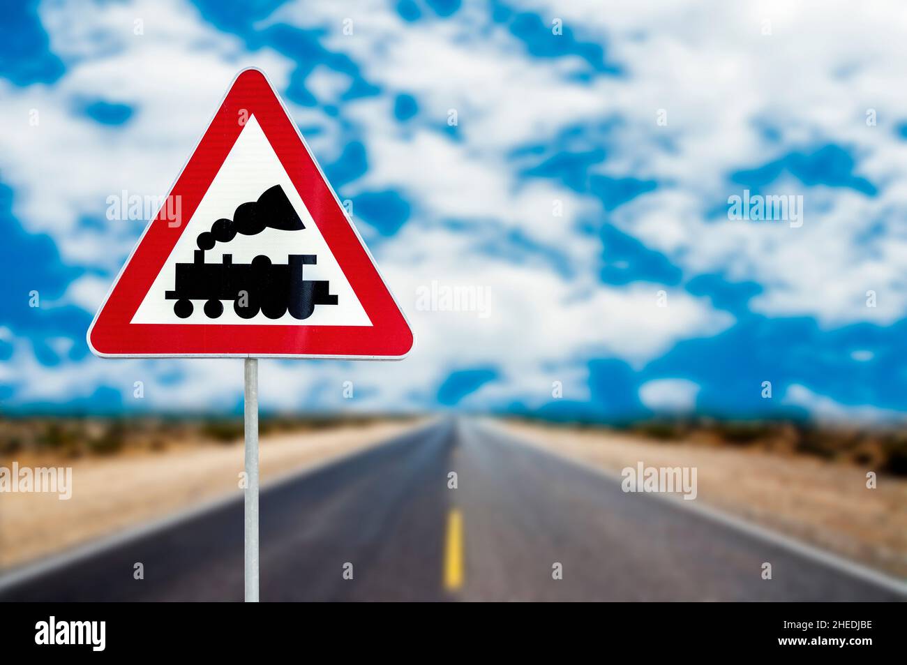 Railroad Level Crossing Sign without barrier or gate ahead the road ...