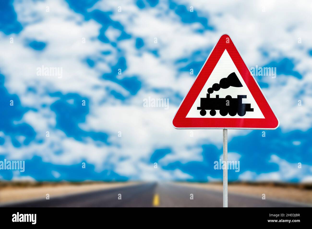 Railroad Level Crossing Sign without barrier or gate ahead the road ...