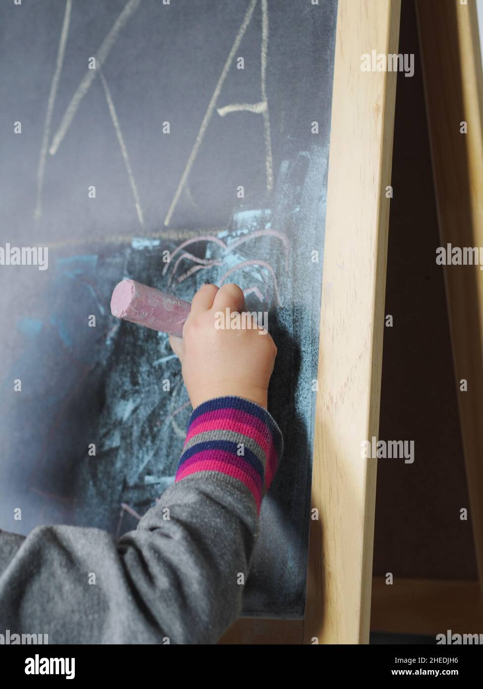 Child writing chalk Stock Photo - Alamy