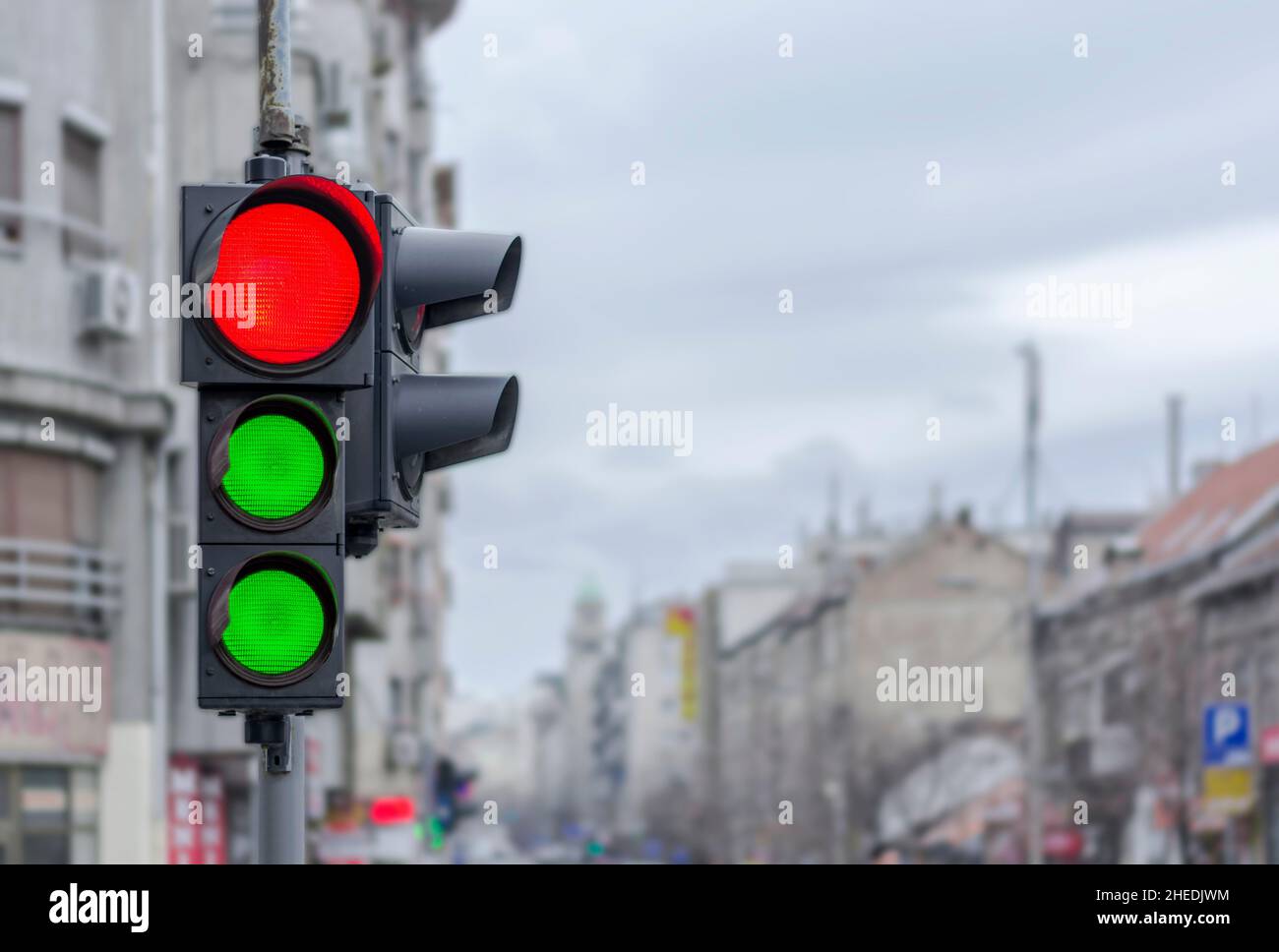Red light and two green semaphore light with blury background Stock ...