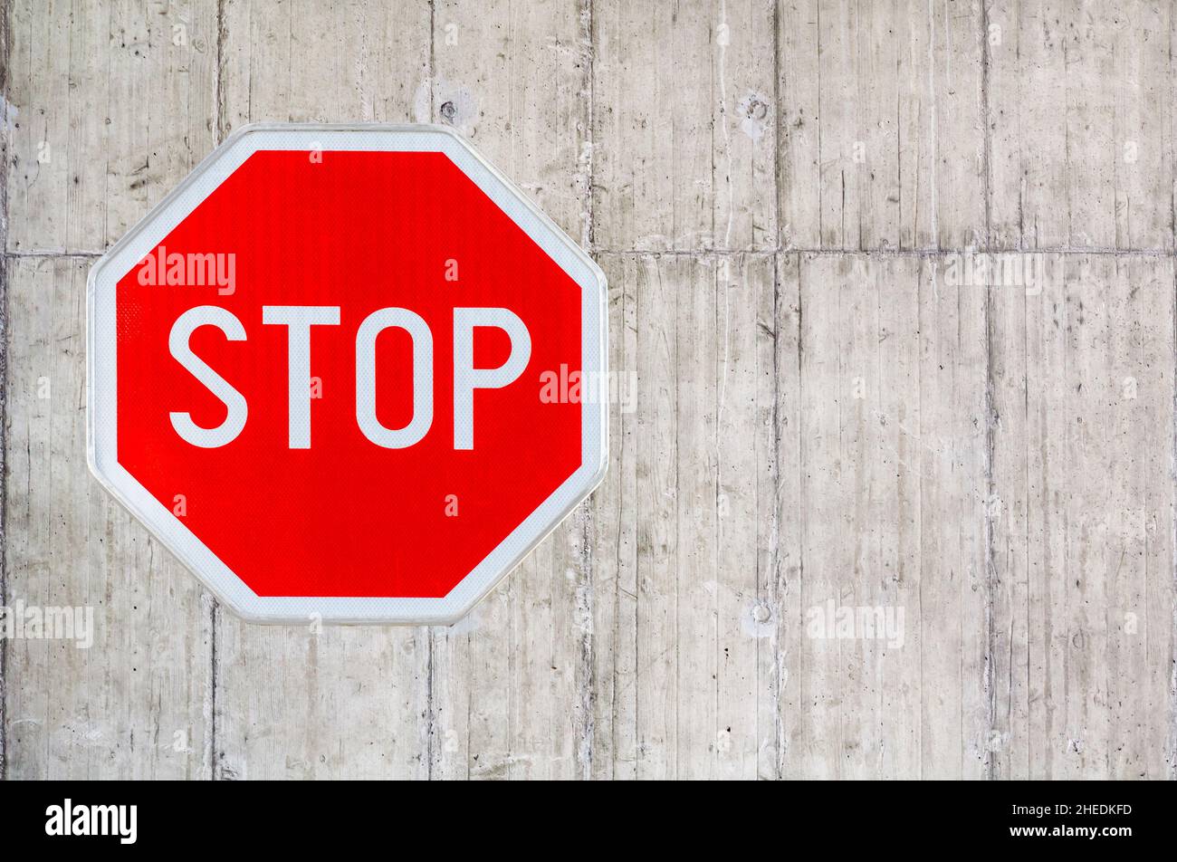 Red stop sign on a rod with Background of red brick wall Stock Photo ...