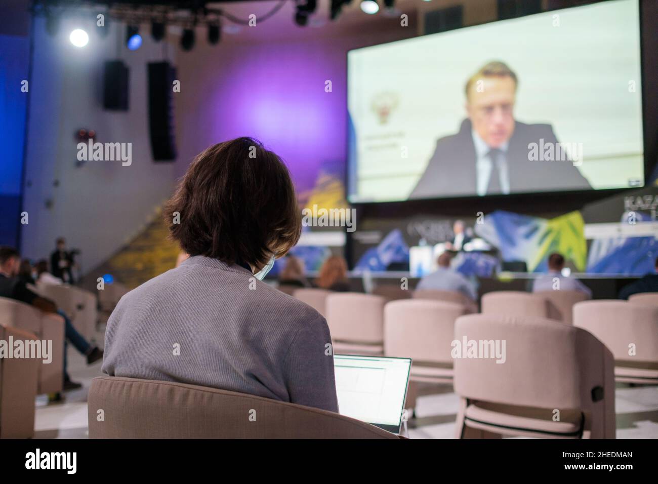 Bored spectator listening to online speaker Stock Photo - Alamy