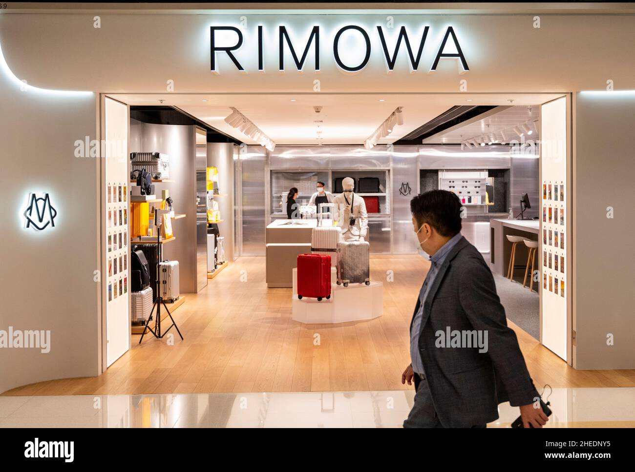 A shopper walks past the Japanese luggage manufacture brand Rimowa ...