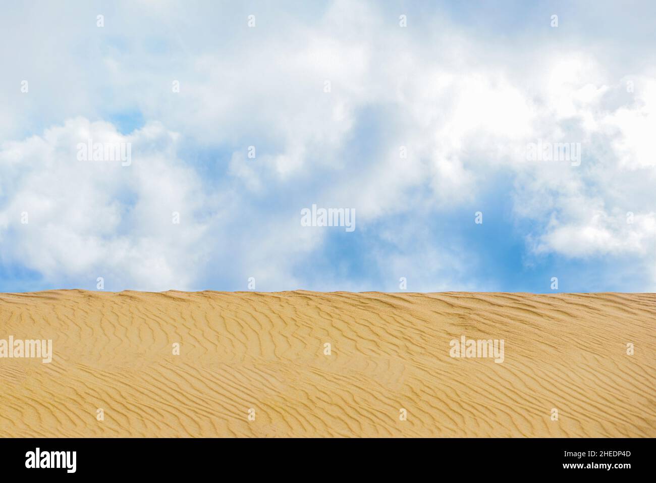Desert landscape with blue sky and yellow sand. Background of dunes and ...