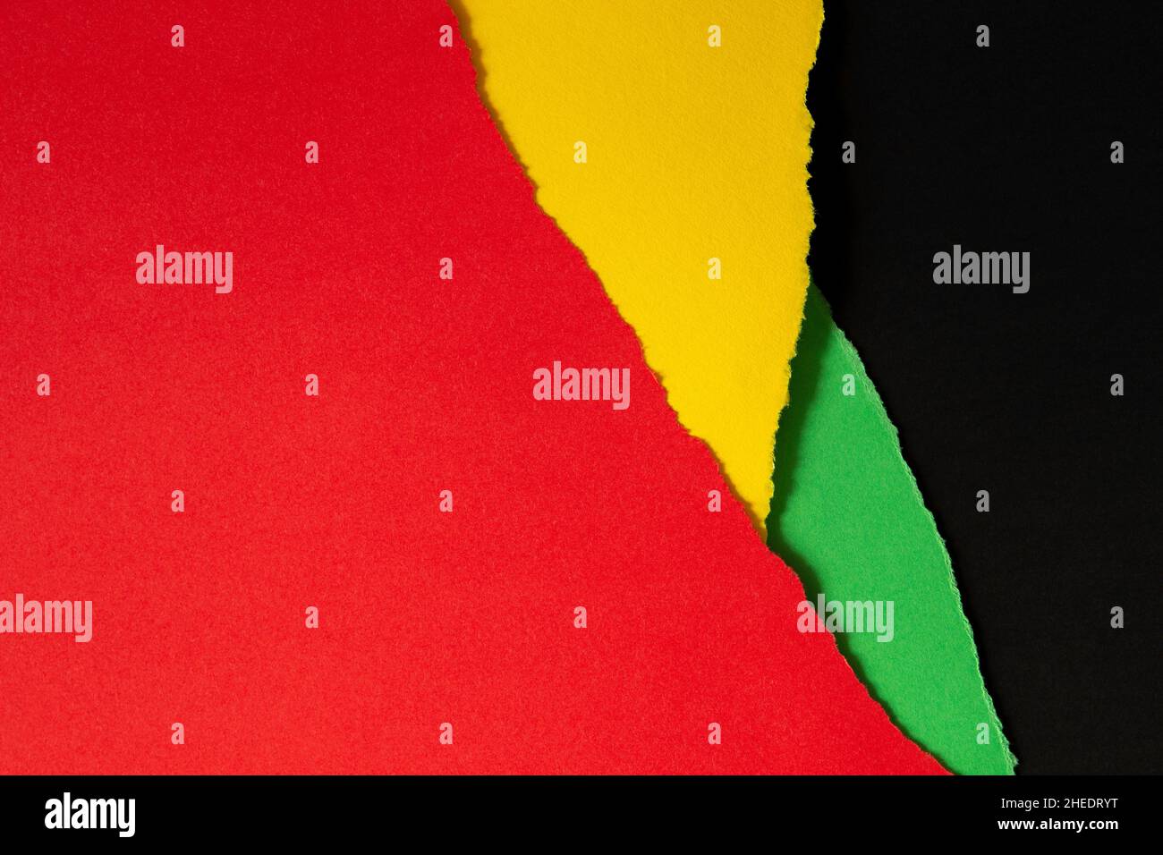 Abstract geometric black, red, yellow, green color paper background ...