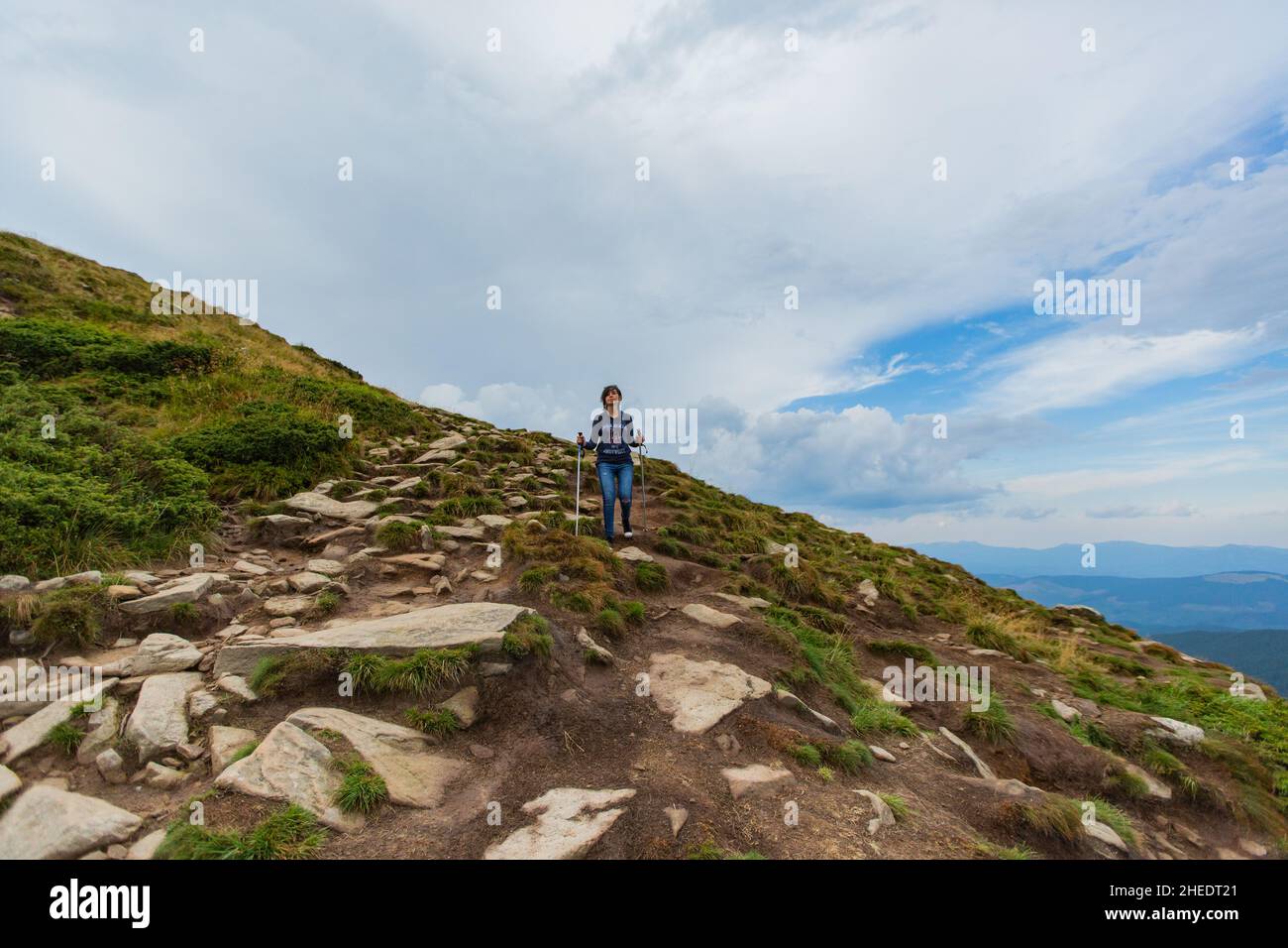 Girl Descend Down a Large Green Mountain Range Stock Photo - Alamy