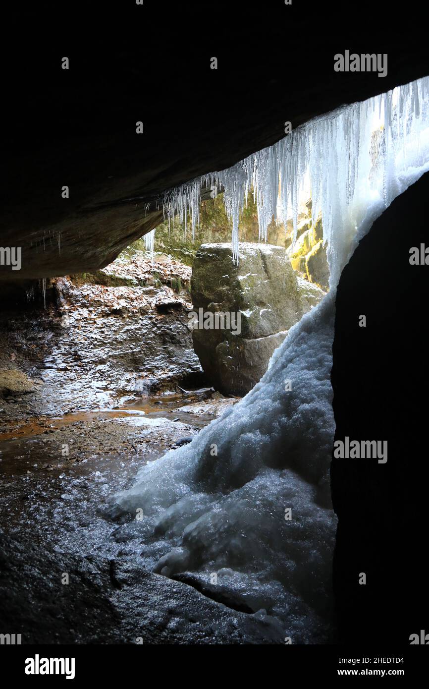 View from a cave in the cold winter Stock Photo - Alamy