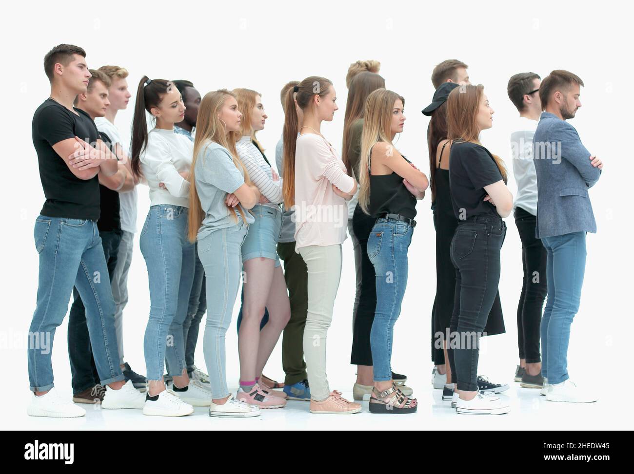 side view. a group of diverse young people standing in a row Stock ...