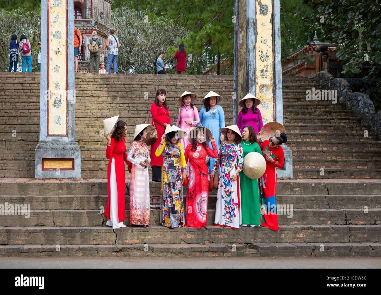 Hue, Vietnam - November 22, 2019: Women in colorful traditional dress ...