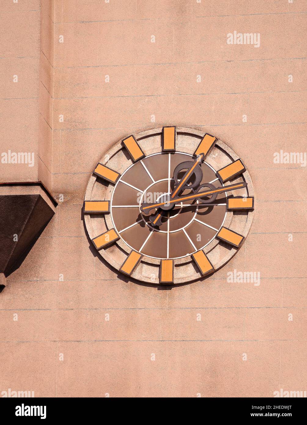 Circle retro wall clock outside on building facade Stock Photo - Alamy