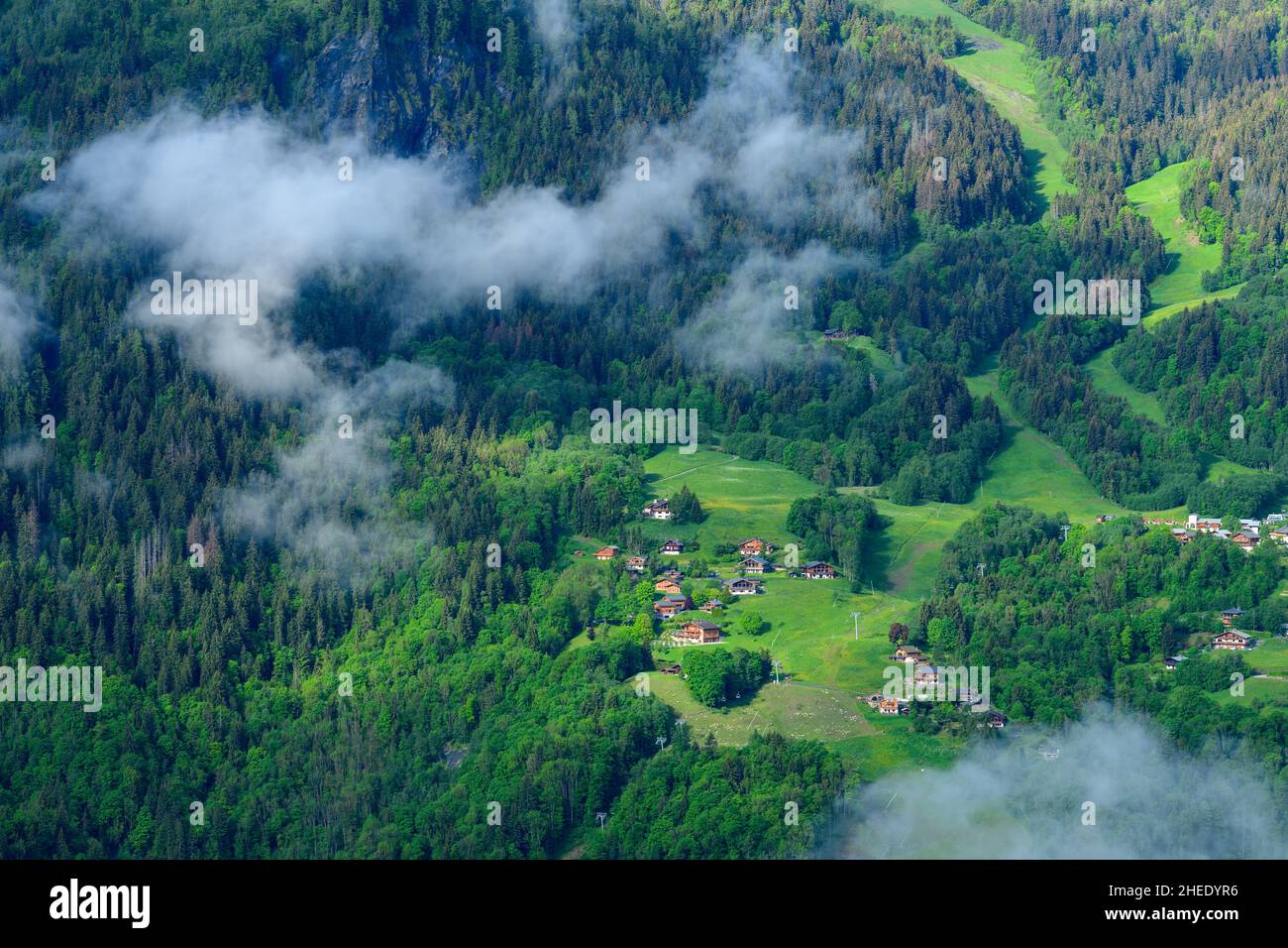Aerial photo of clouds in an alpine valley hi-res stock photography and ...