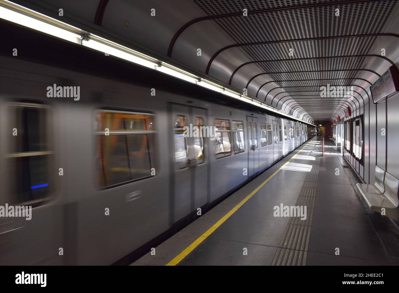 Donauinsel metro (U-Bahn) station platform and passing train in Vienna ...