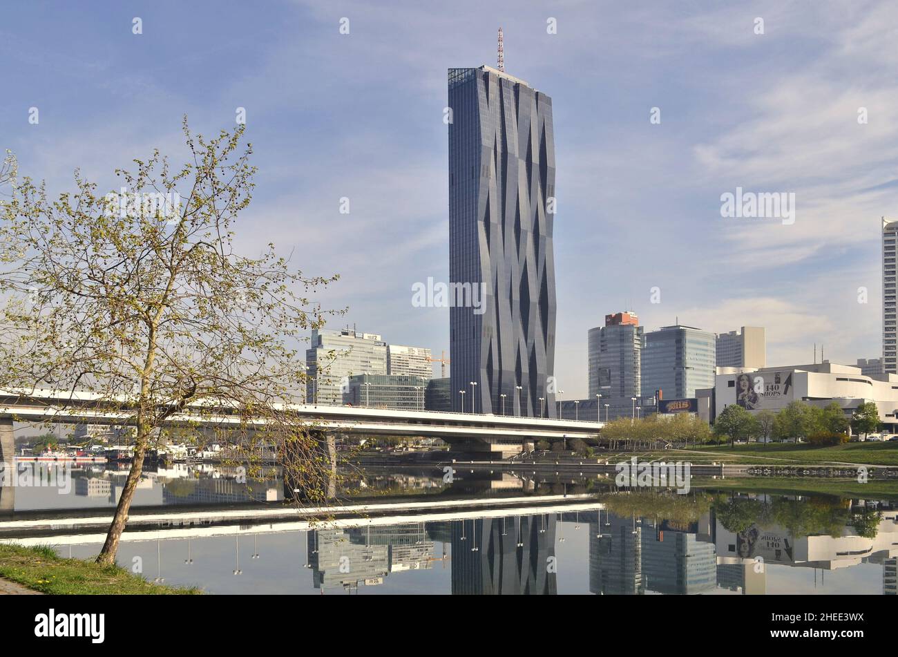 DC Tower 1 - modern landmark skyscraper reflecting in river Danube at ...