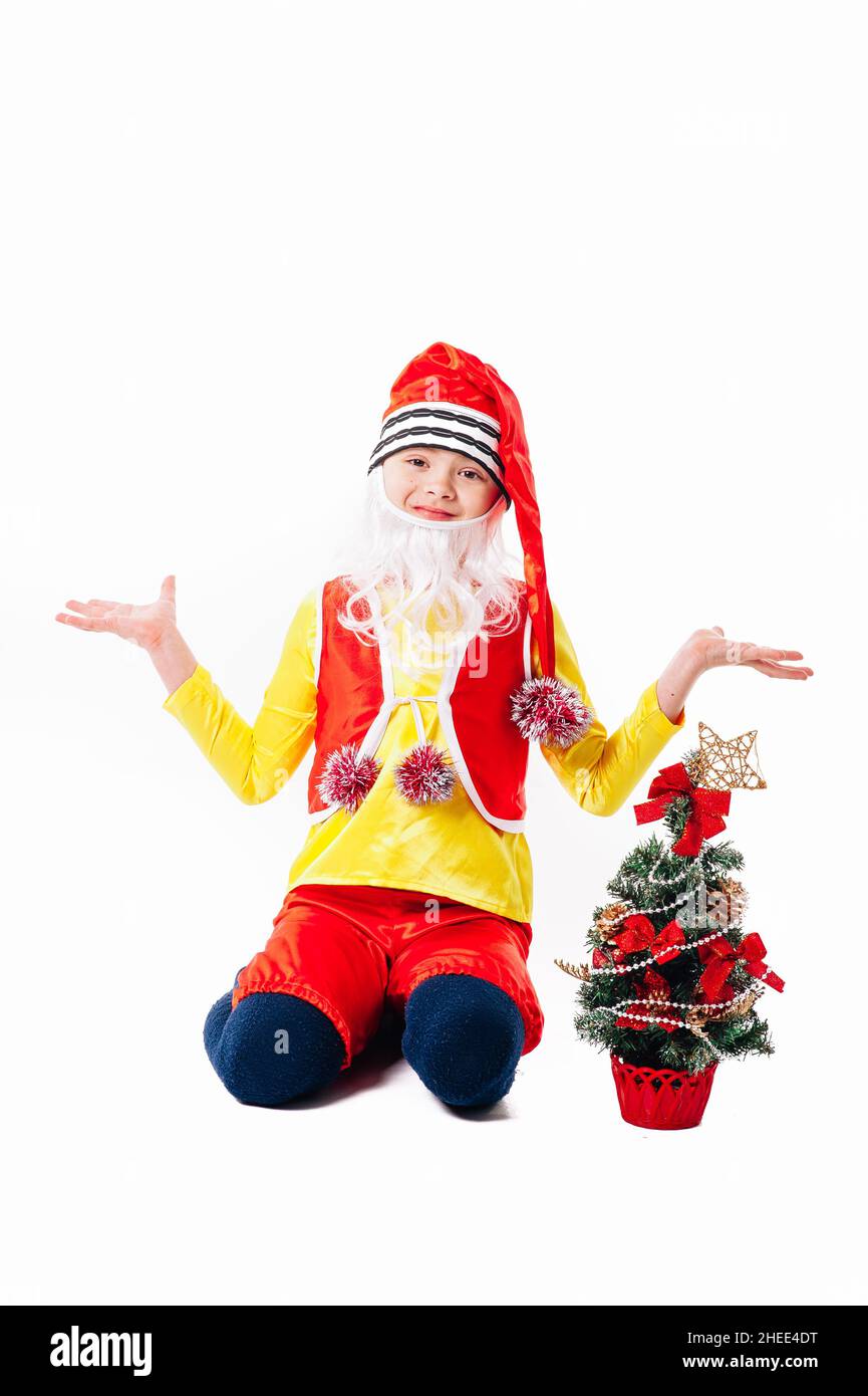 A baby dressed as a elf. isolated. Santa's helper. boy in suit of dwarf ...