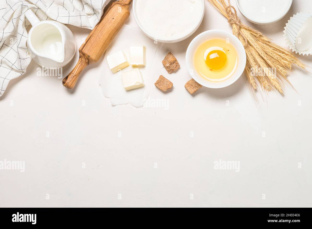 Baking ingredients at blue table top view Stock Photo - Alamy