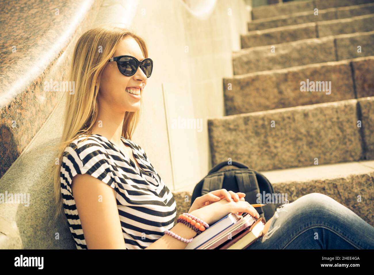 Student girl at staircase Stock Photo - Alamy