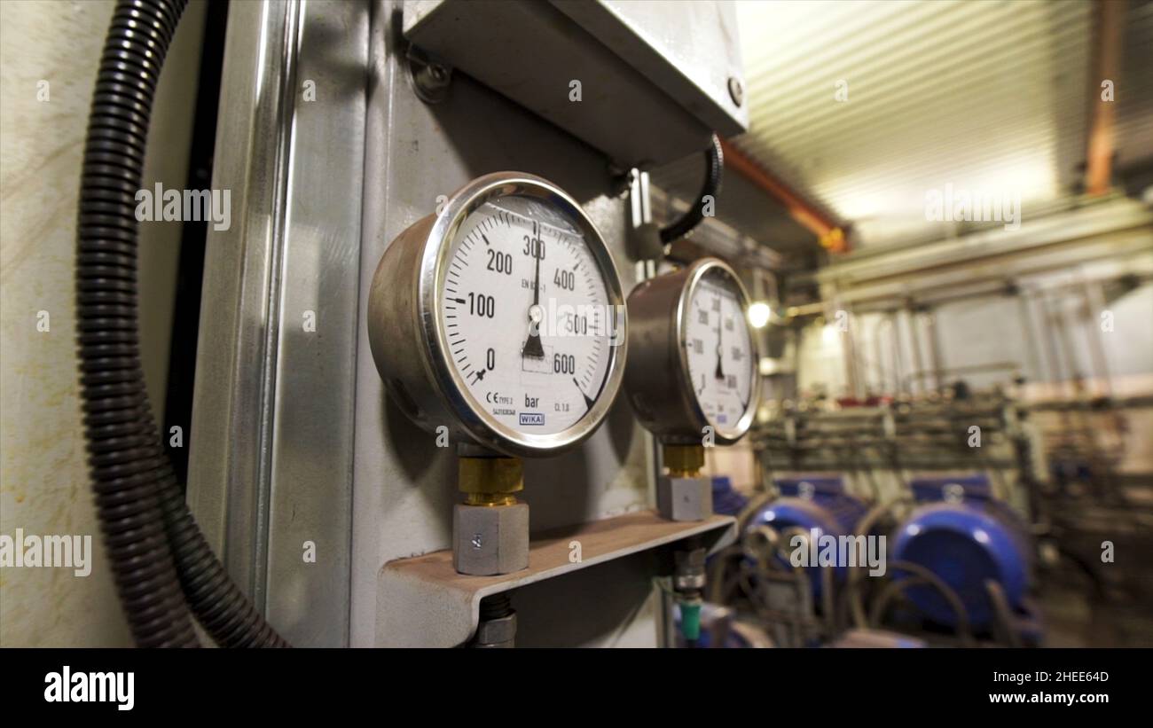 Close up of manometers, pipes and faucet valves of heating system in a ...