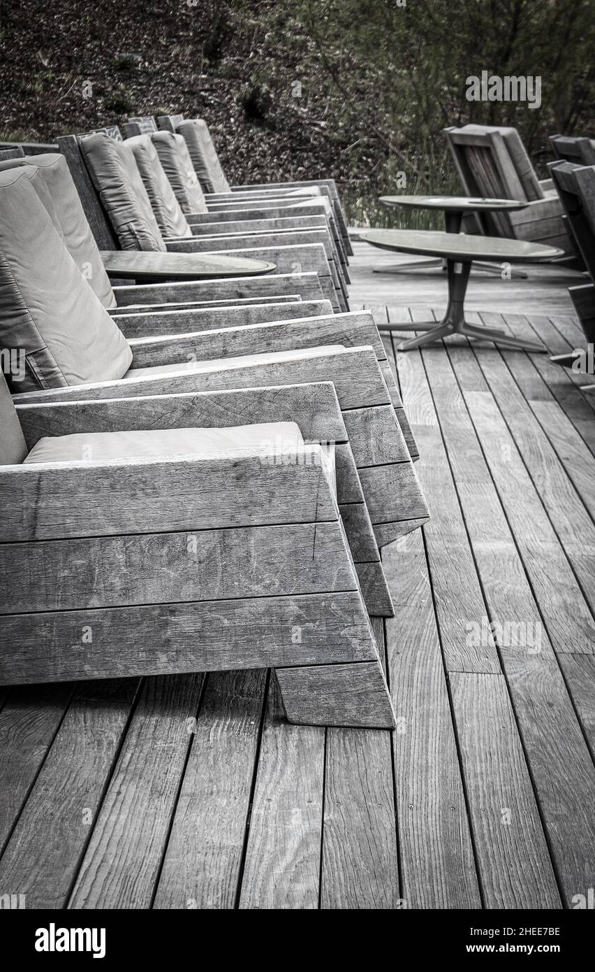 Modern Rustic rocking chairs lined up on Deck - Black and White - Focus ...