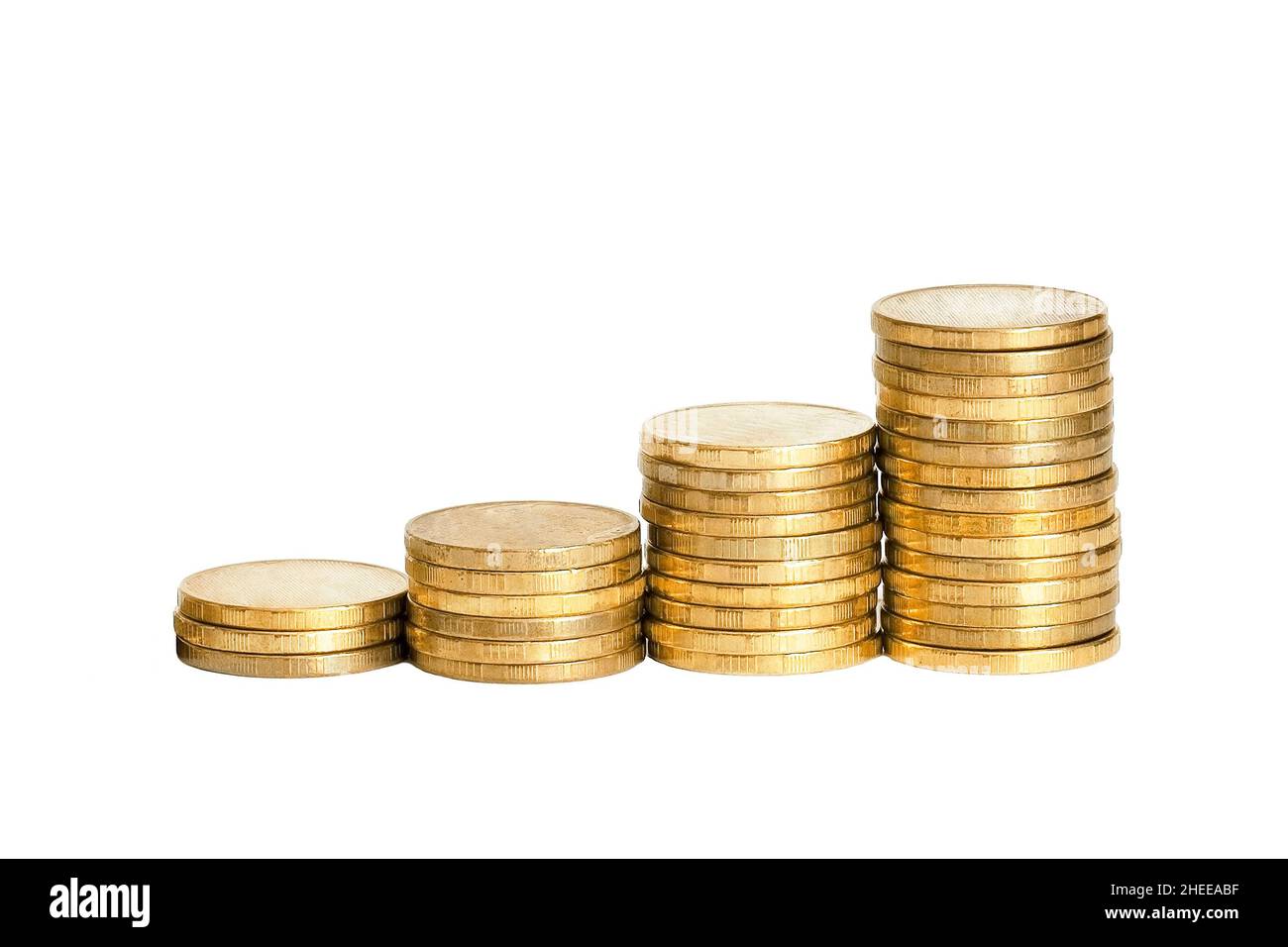 Four stacks of coins isolate on white background. Money growth concept ...