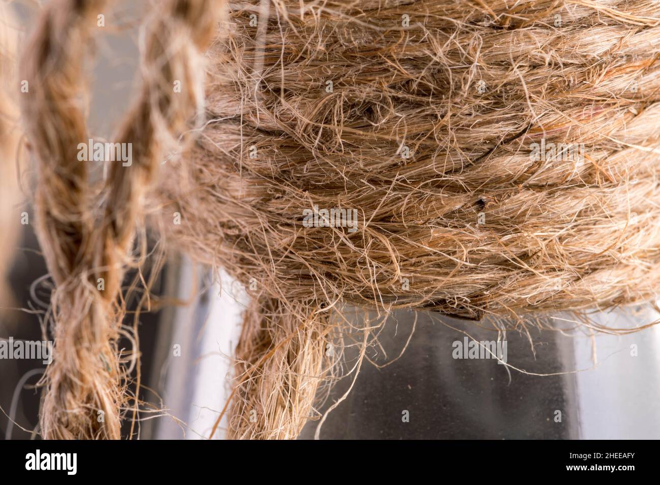 bast rope around a bottle neck Stock Photo - Alamy