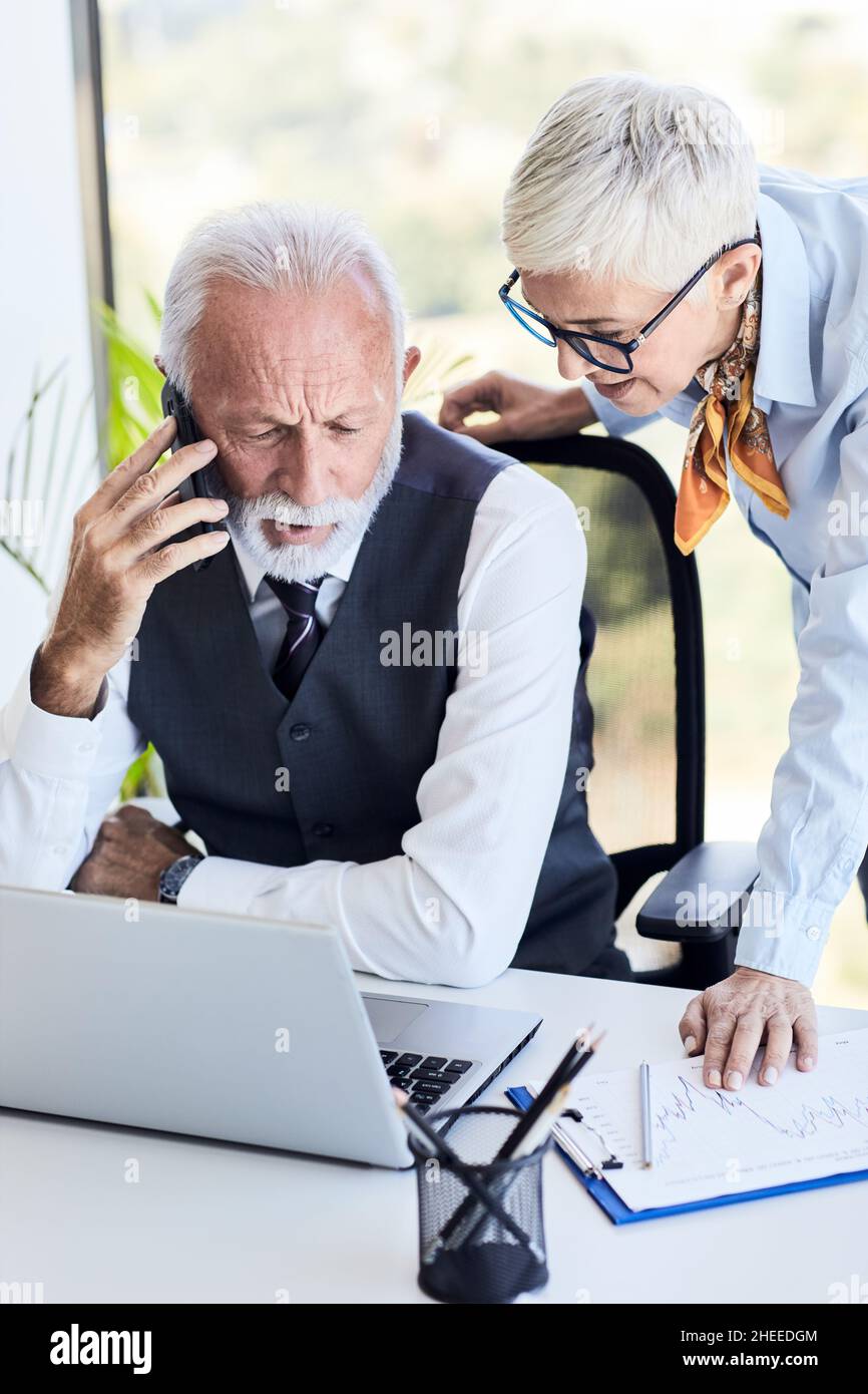 Female office worker phone senior hi-res stock photography and images ...
