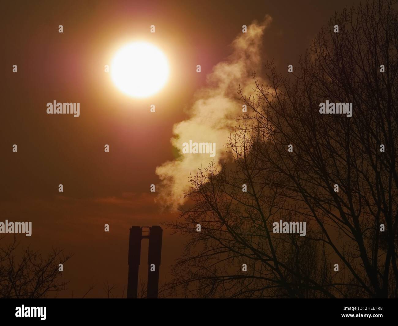 industrial chimneys sun Stock Photo - Alamy