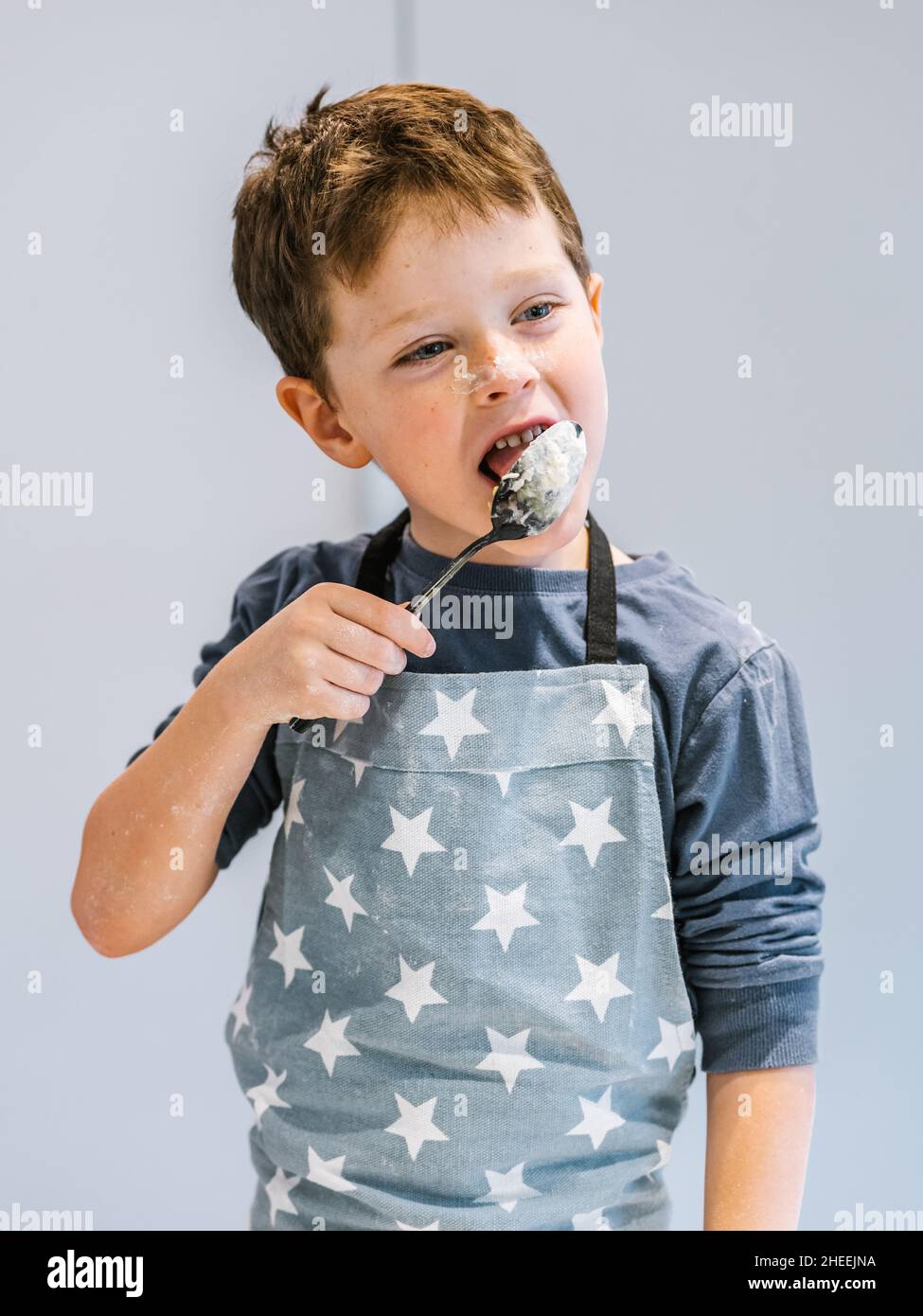 Licking the spoon hi-res stock photography and images - Alamy