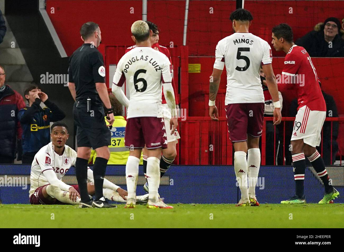 Aston Villa's Ezri Konsa (left) reacts to an injury during the Emirates ...