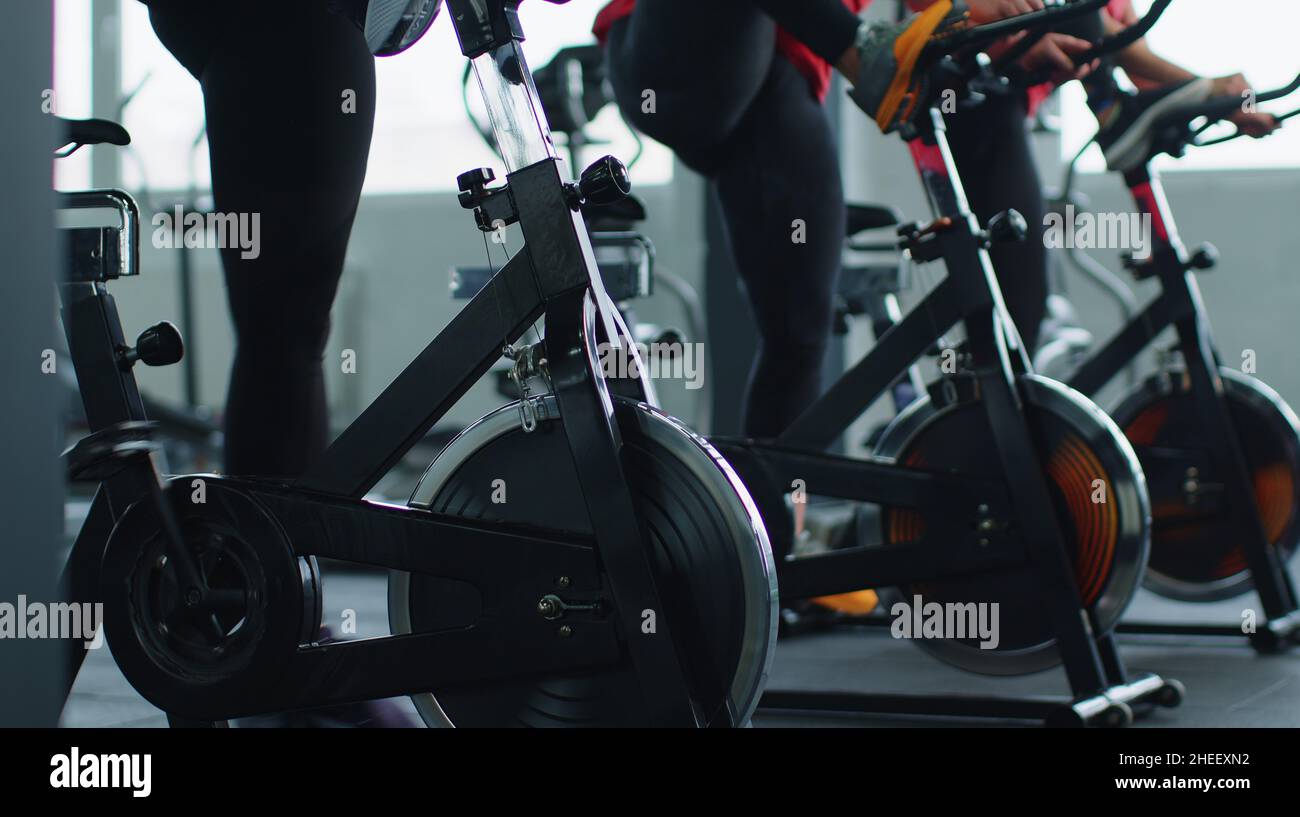 Healthy Caucasian group of women exercising workout on stationary ...