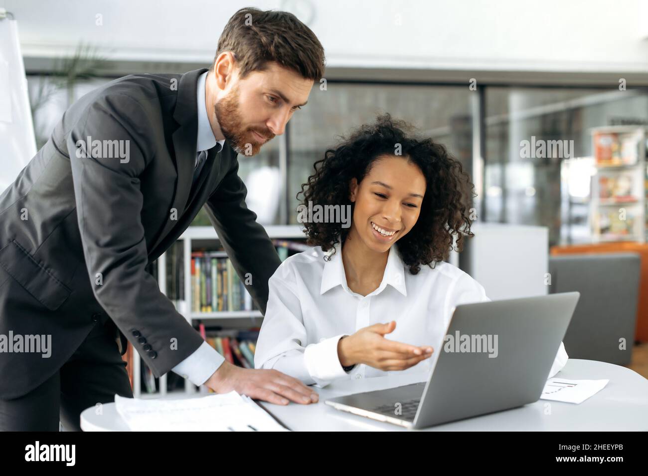 Brainstorm. Two successful business partners of different nationalities ...