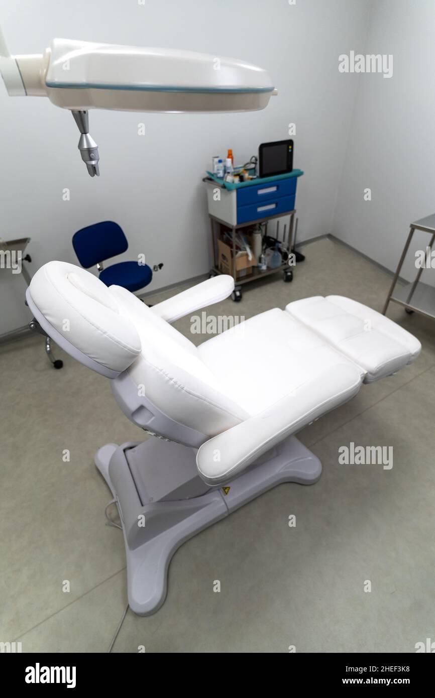 Stretcher in an empty operating room of an aesthetic medicine clinic ...