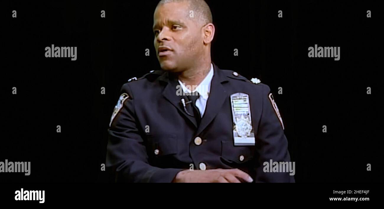 A COPS AND ROBBERS STORY, Corey Pegues in archival footage, 1990s, 2020 ...